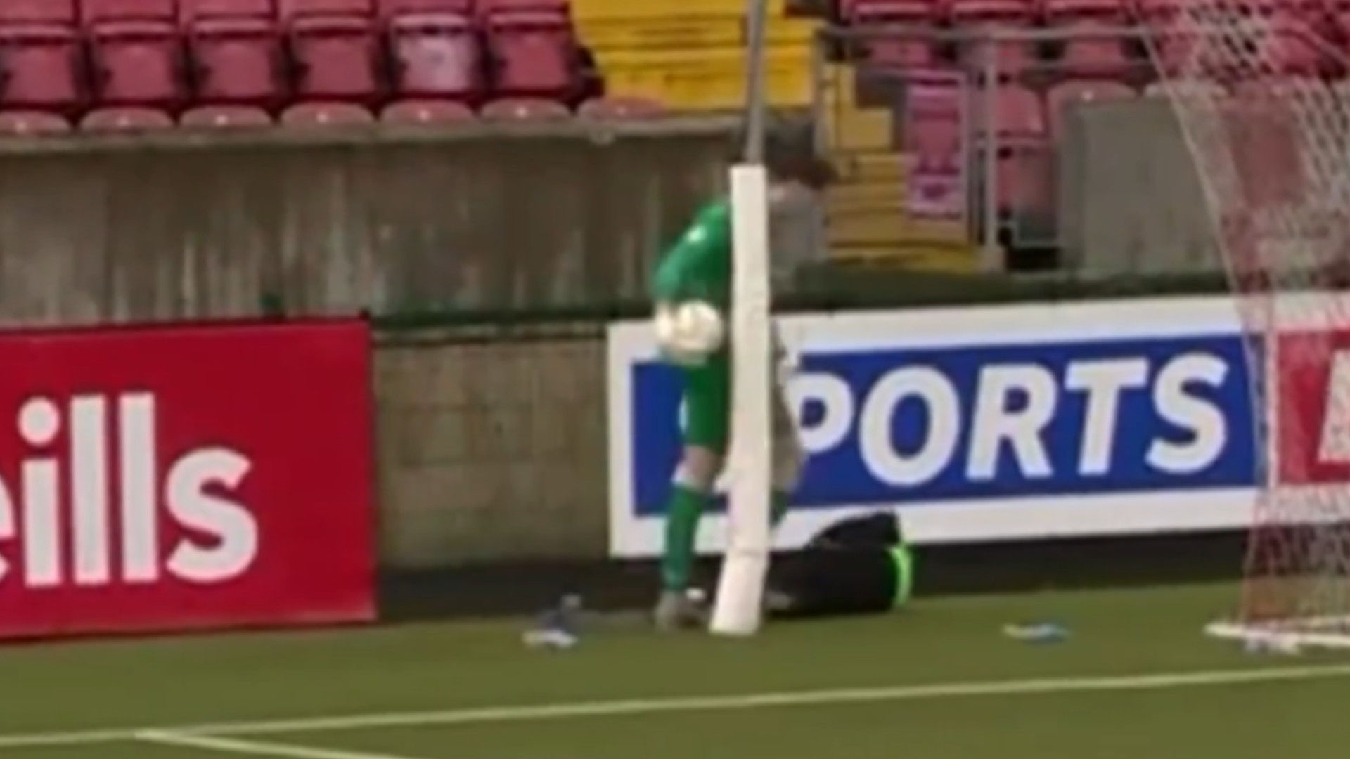 Scandal in Northern Irish football after a goalkeeper seemingly pushes a ball boy to the ground ...