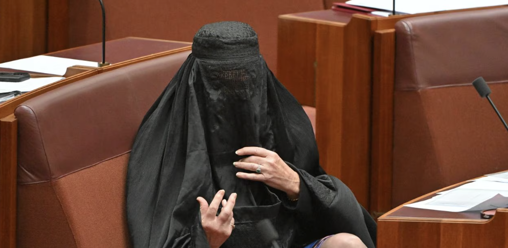 Far-right Australian senator suspended from Parliament for wearing ...